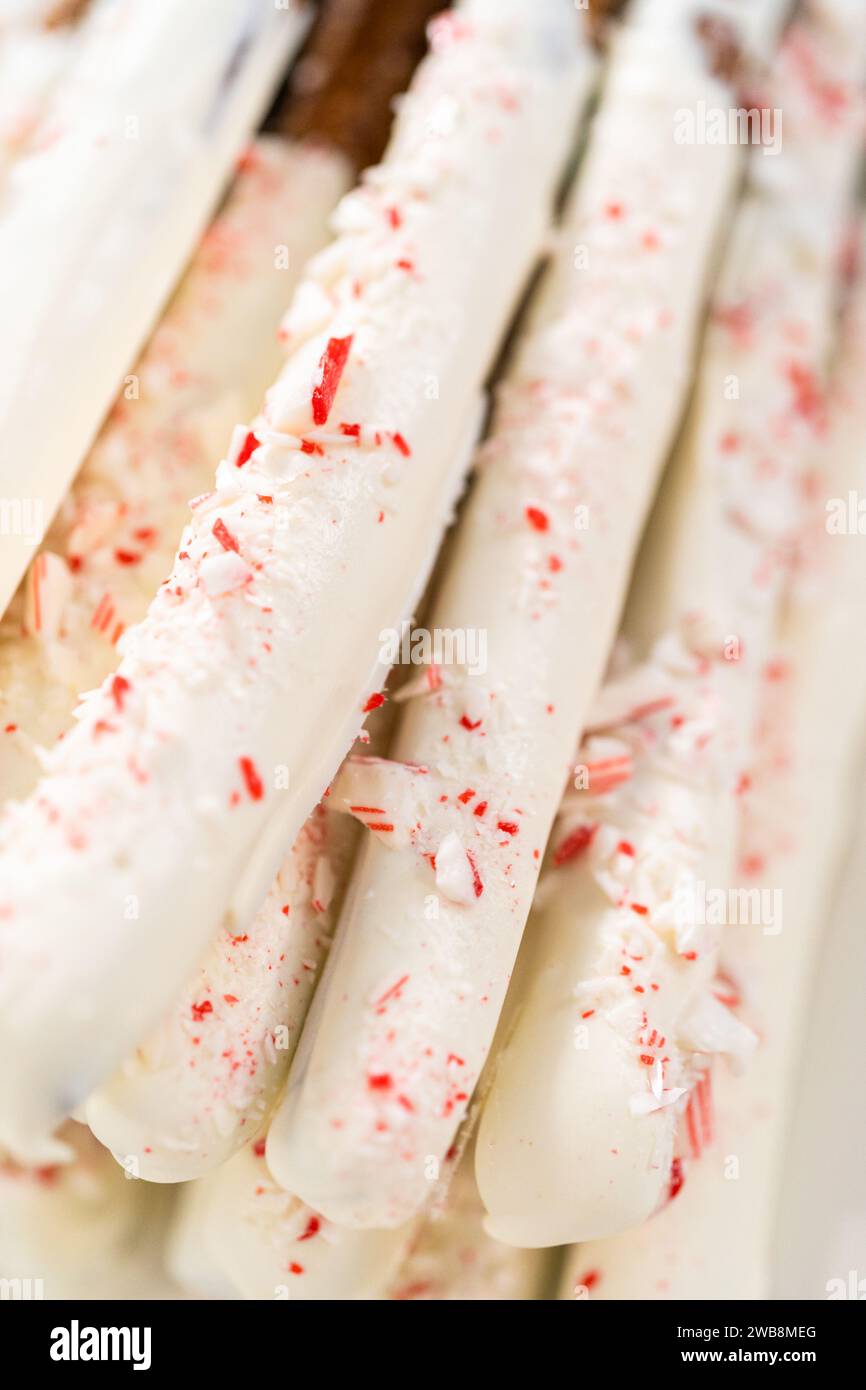 Candy cane chocolate covered pretzel rods Stock Photo - Alamy