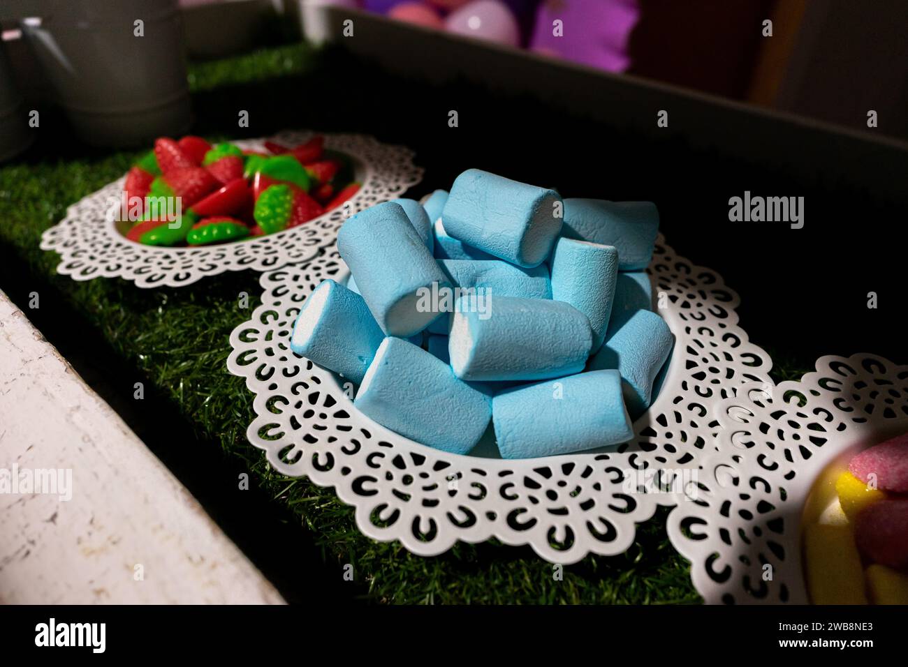 Colorful blue marshmallow candies on a plate, adding a sweet touch to a ...