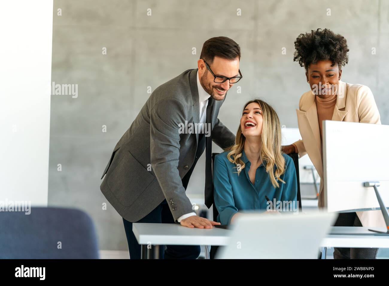 Group of multiethnic business people analyzing data using computer ...