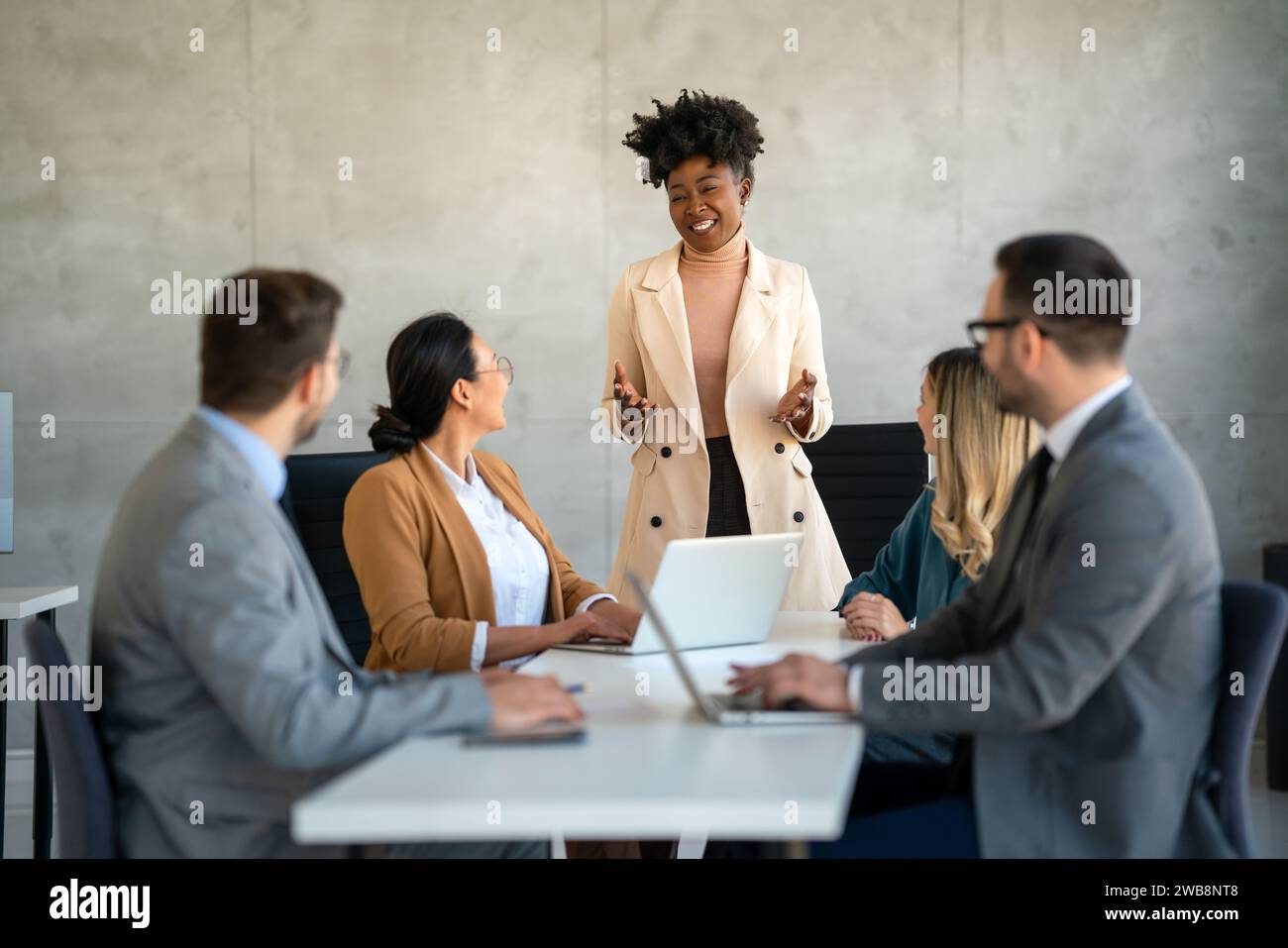 Successful multiethnic business people presenting analytical report ...