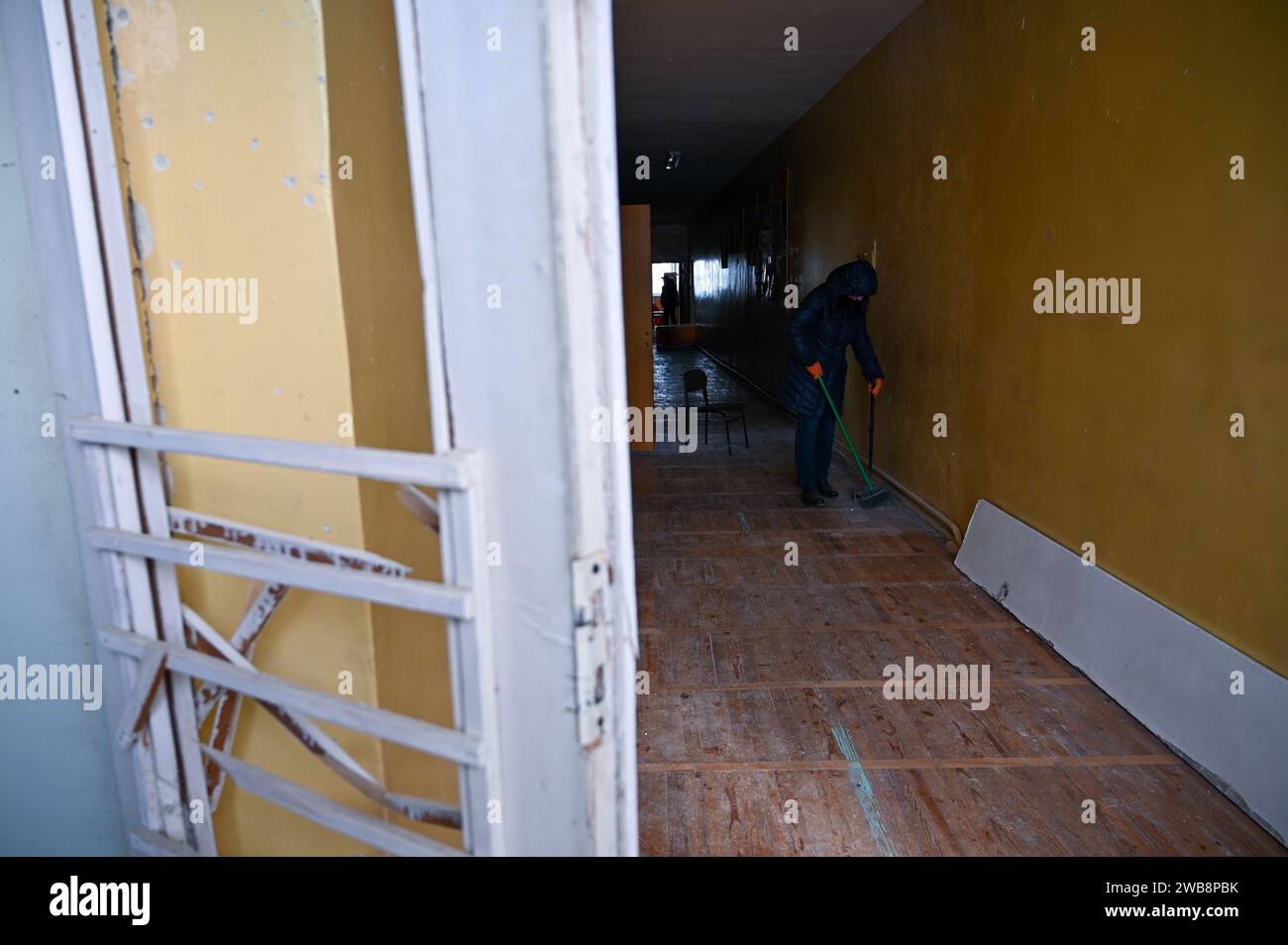 Non Exclusive: LVIV, UKRAINE - JANUARY 08, 2024 - A woman sweeps the ...