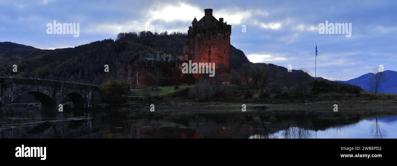 Sunset view over Eilean Donan Castle, Dornie village, Kyle of Lochalsh ...