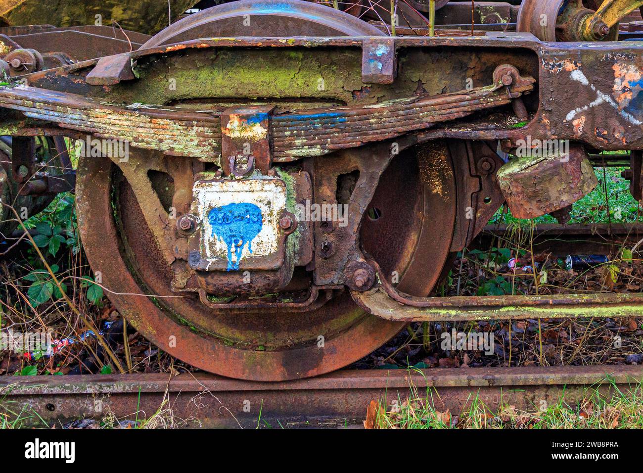 Very old damaged, worn and rusty railway disc wheels in close-up with ...