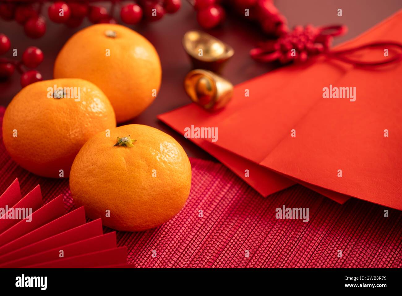 Chinese lunar new year background with fresh tangerine, red envelope ...