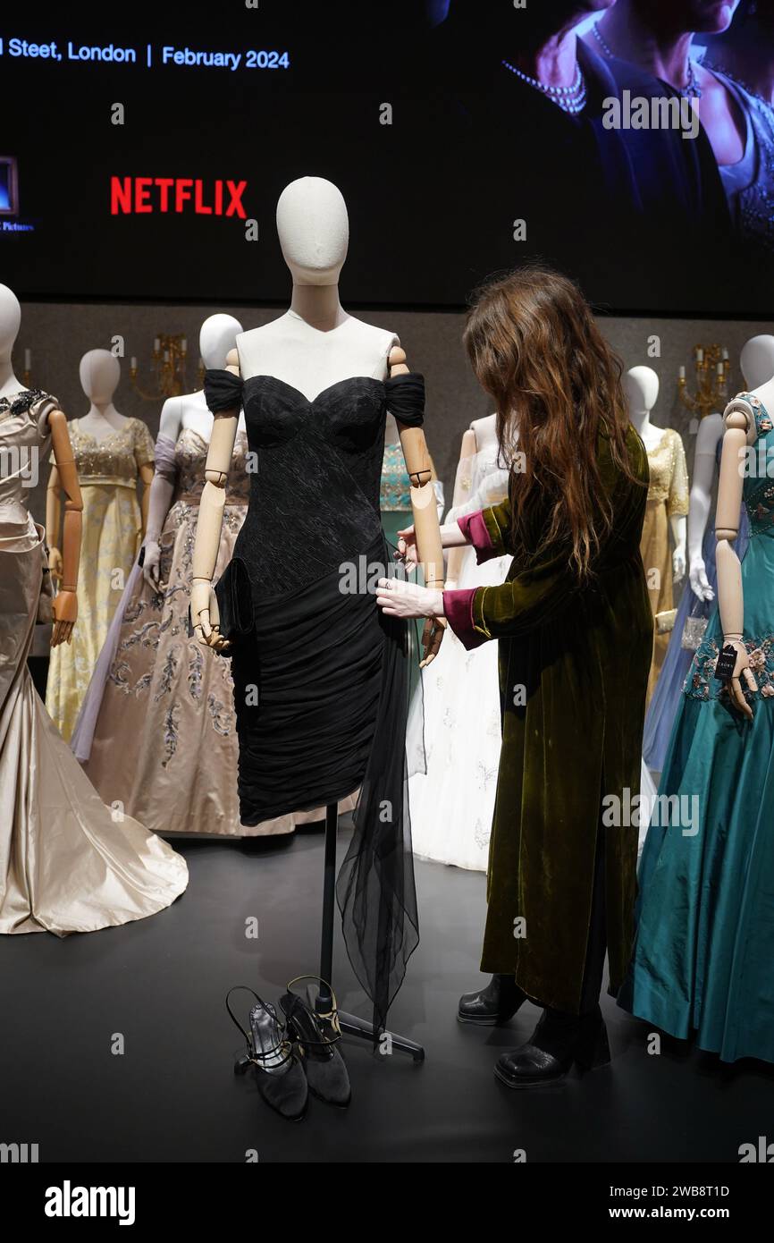 A gallery assistant adjusts a reproduction of Princess Diana's revenge ...