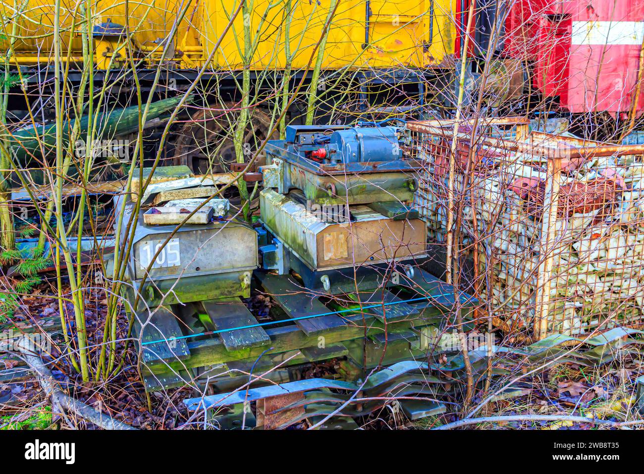 Close-up of industrial garbage in an old disused train station, pallet ...