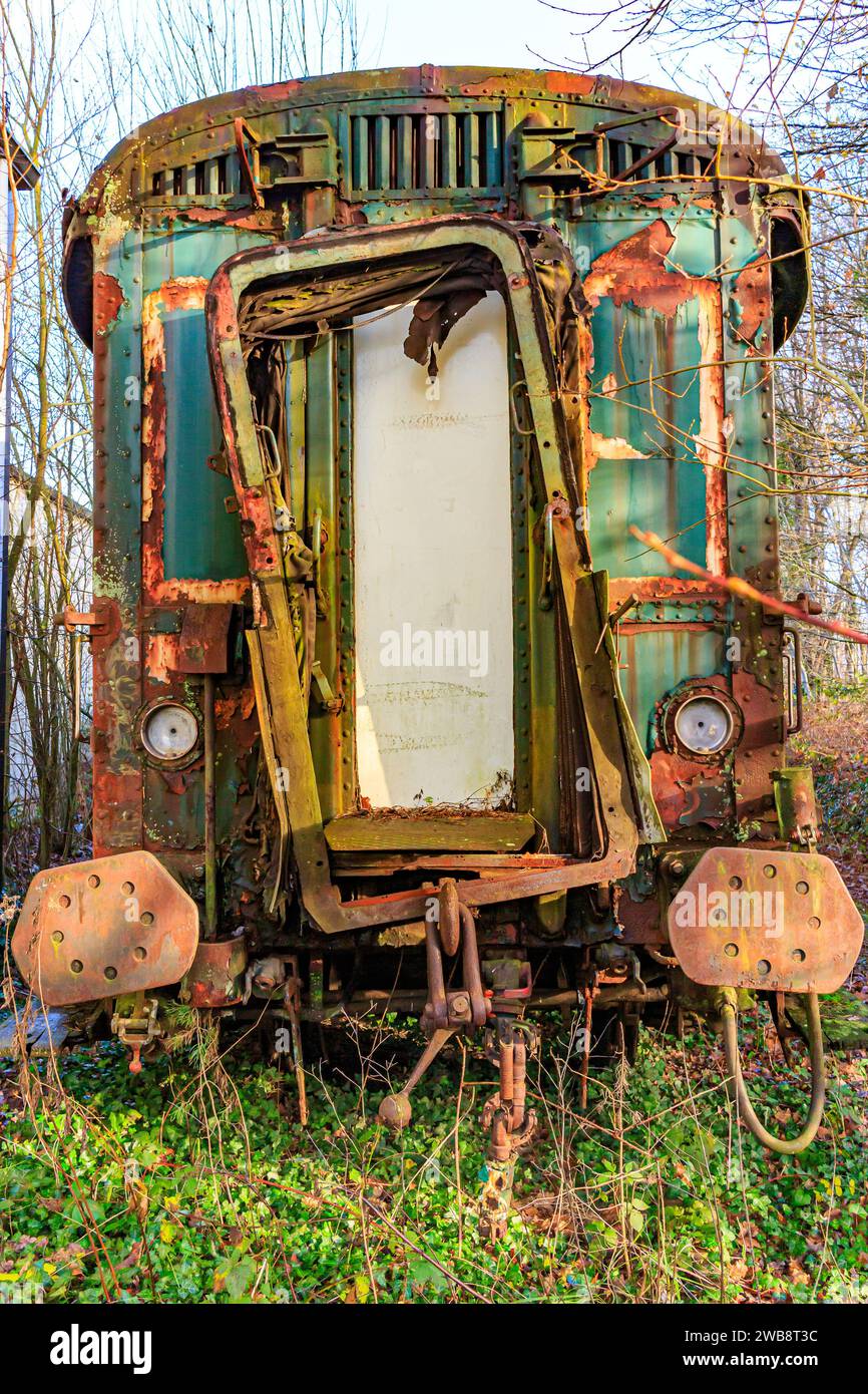 Front view of dilapidated, rusty, damaged and abandoned train carriage ...