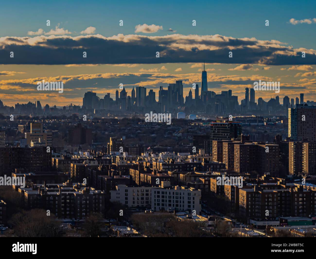 An aerial view of Queens, New York before a sunset with buildings in ...