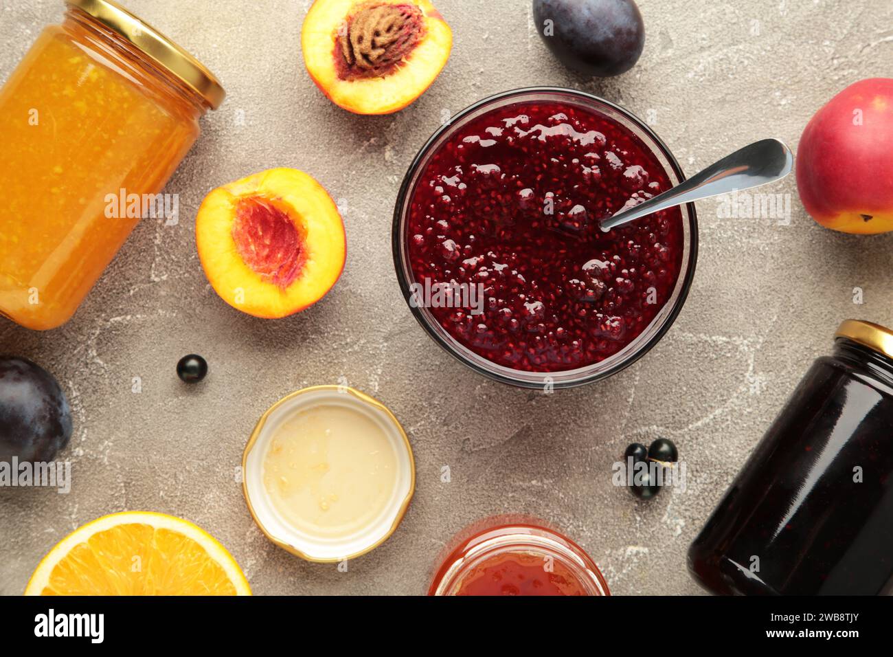 Homemade fruit jam in the jar on grey background Stock Photo - Alamy