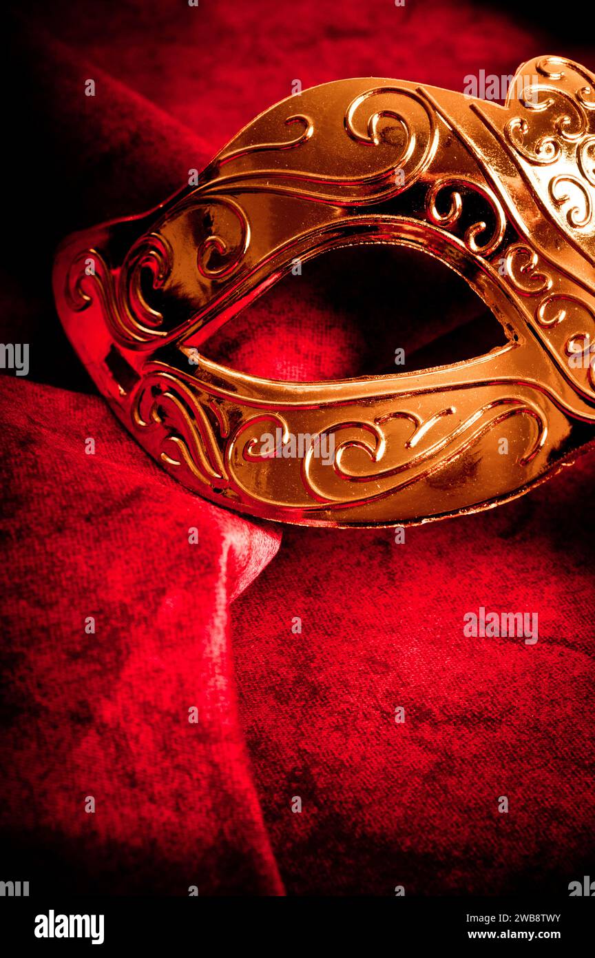golden mask on red velvet Stock Photo - Alamy