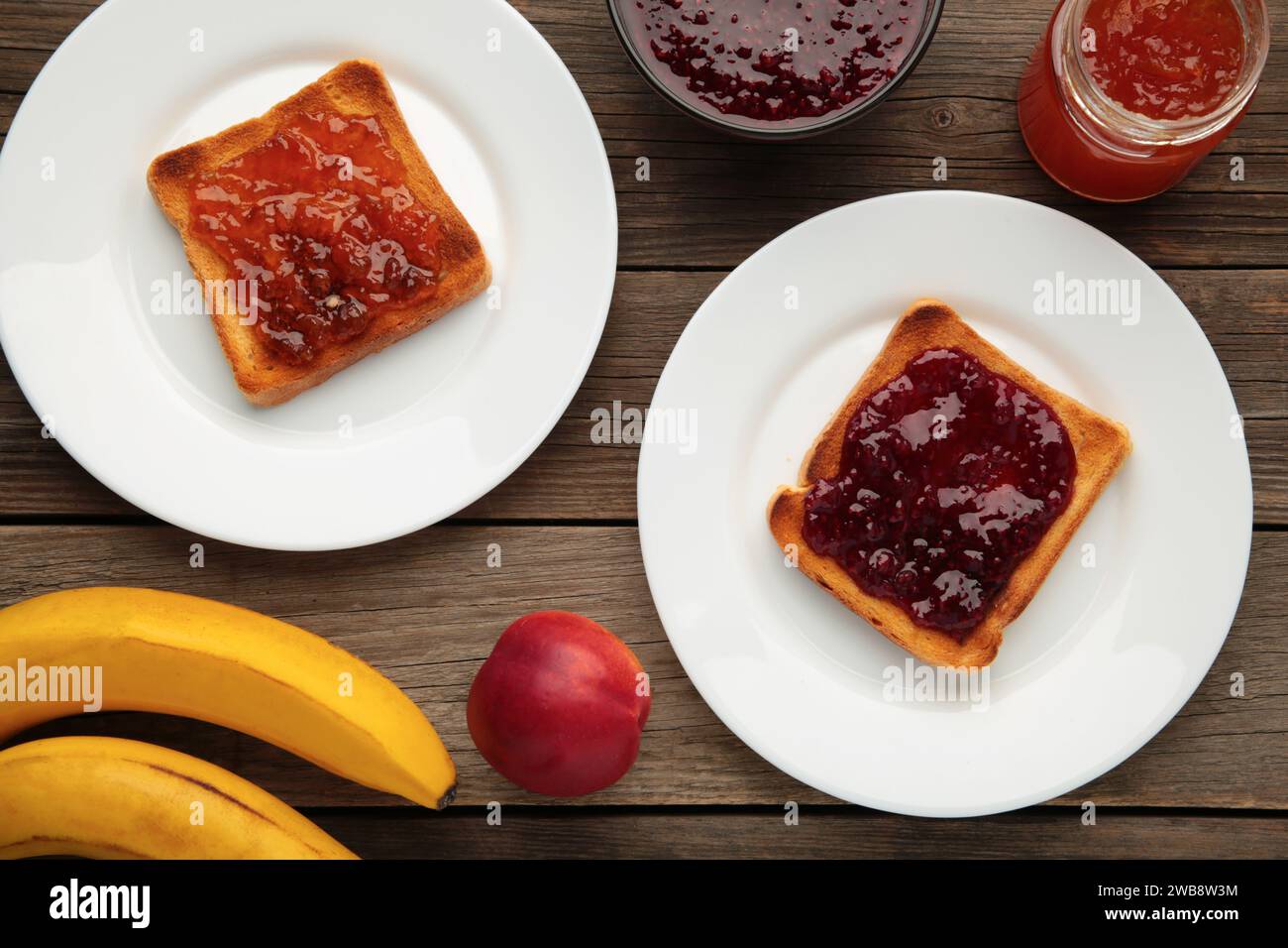 Sweet toasts with jam and fruit for breakfast, horizontal. Top view ...