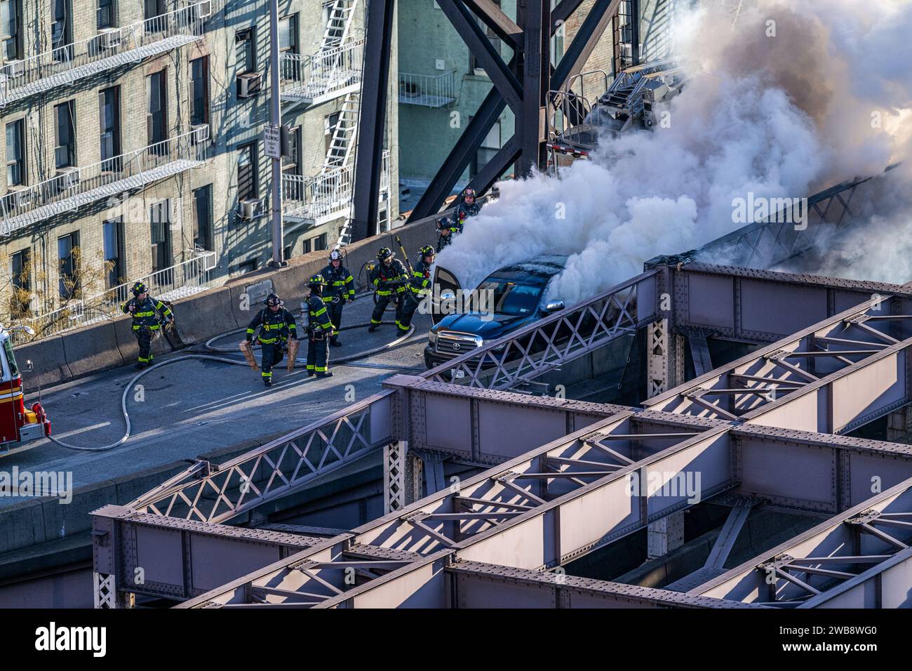 An aerial view of the Fire Department responding to a car fire on the ...