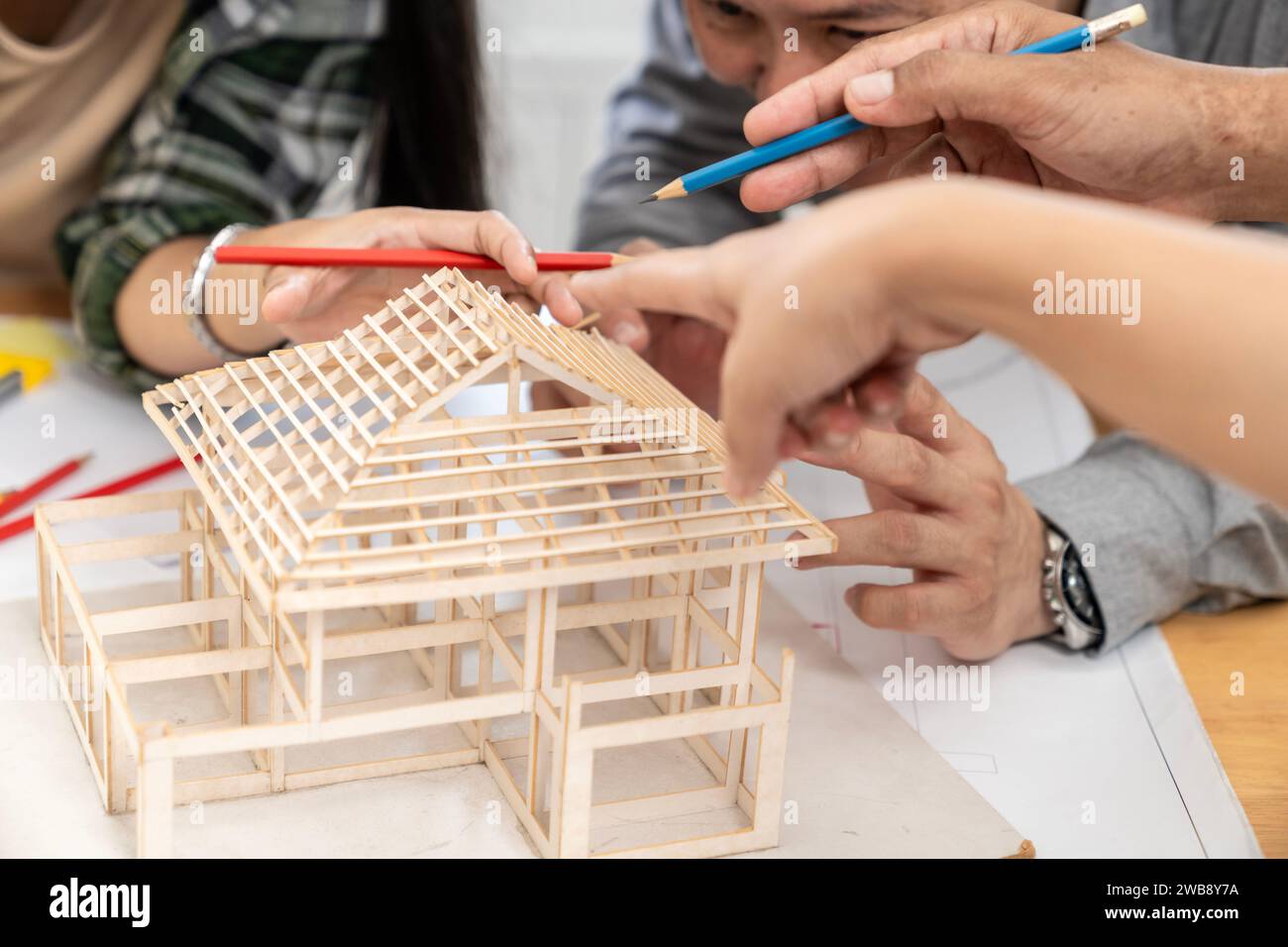 Group young architects model house hi-res stock photography and images ...