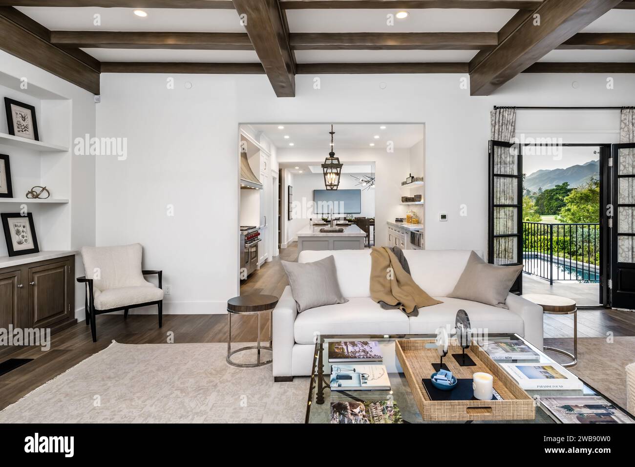 This modern living room features a contemporary coffee table with a ...