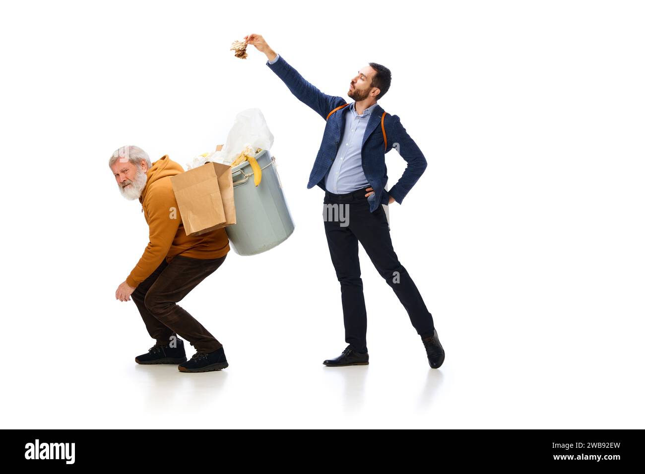 Sorting garbage types. Two men with trash bins on backs cleaning ...