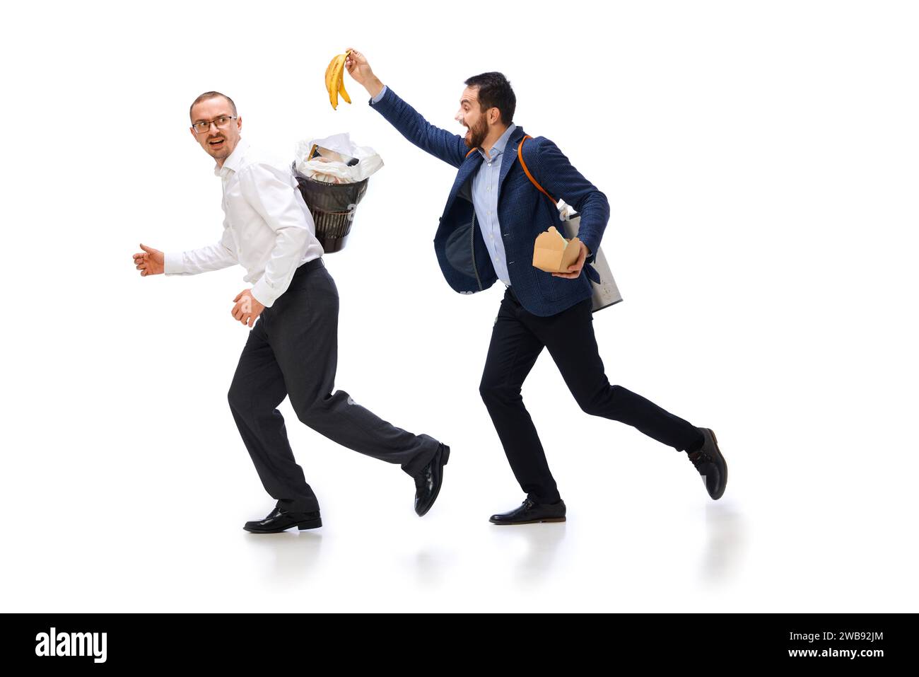 Sorting garbage types. Two men with trash bins on backs cleaning ...