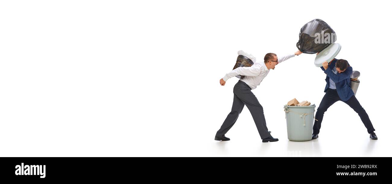 Cleaning is important. Two men with trash bins fighting isolated over ...