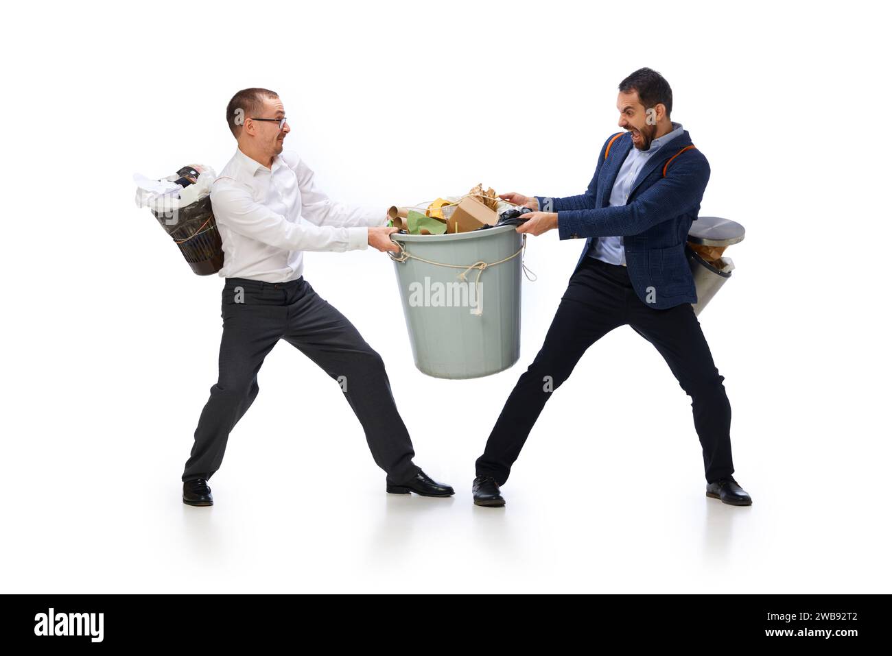 Two men fighting for trash bins isolated over white background. Taking ...