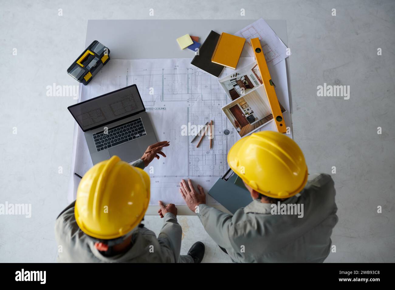 Construction engineers working on project for client, checking ...