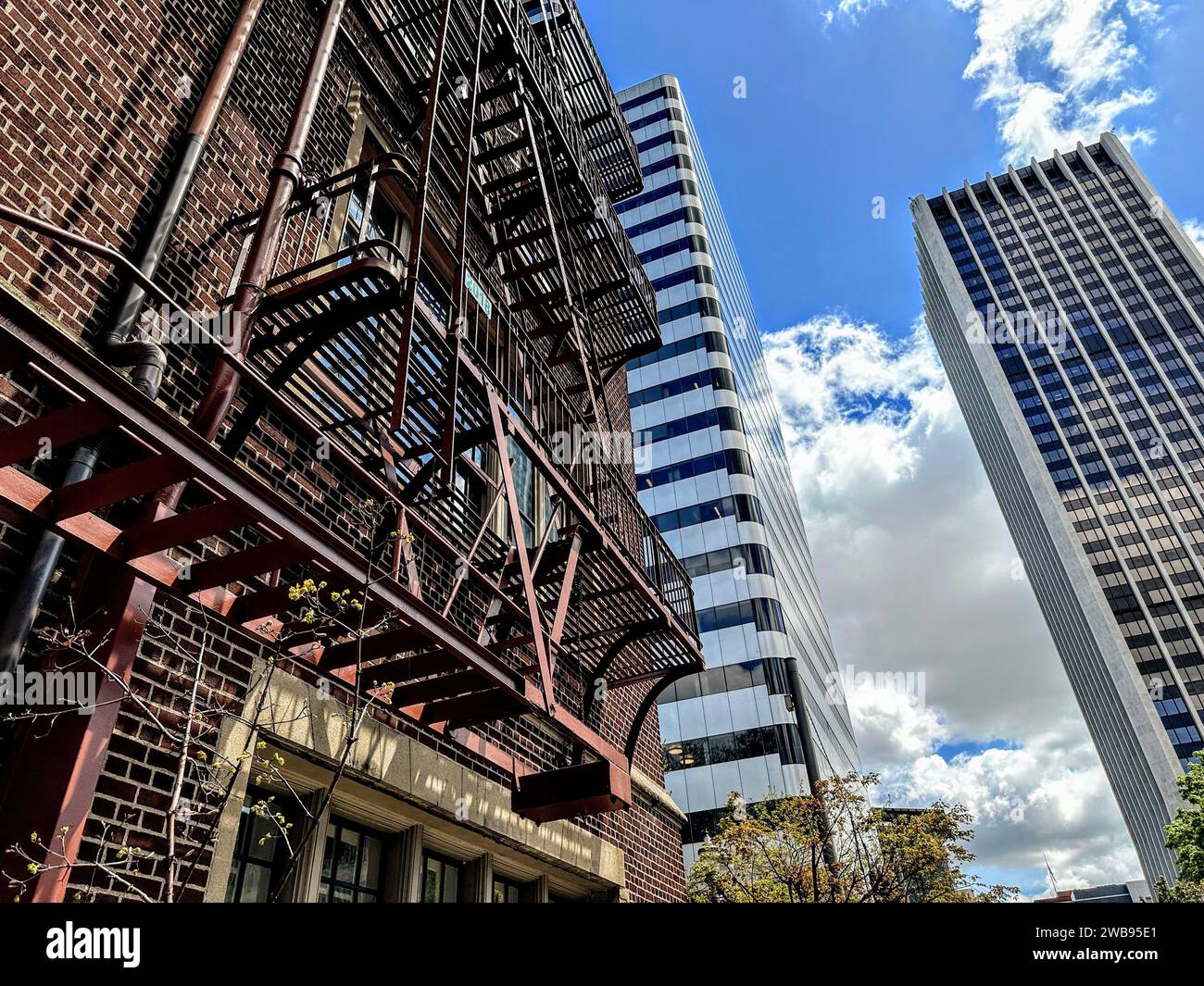 This picture displays a modern skyscraper standing in juxtaposition ...
