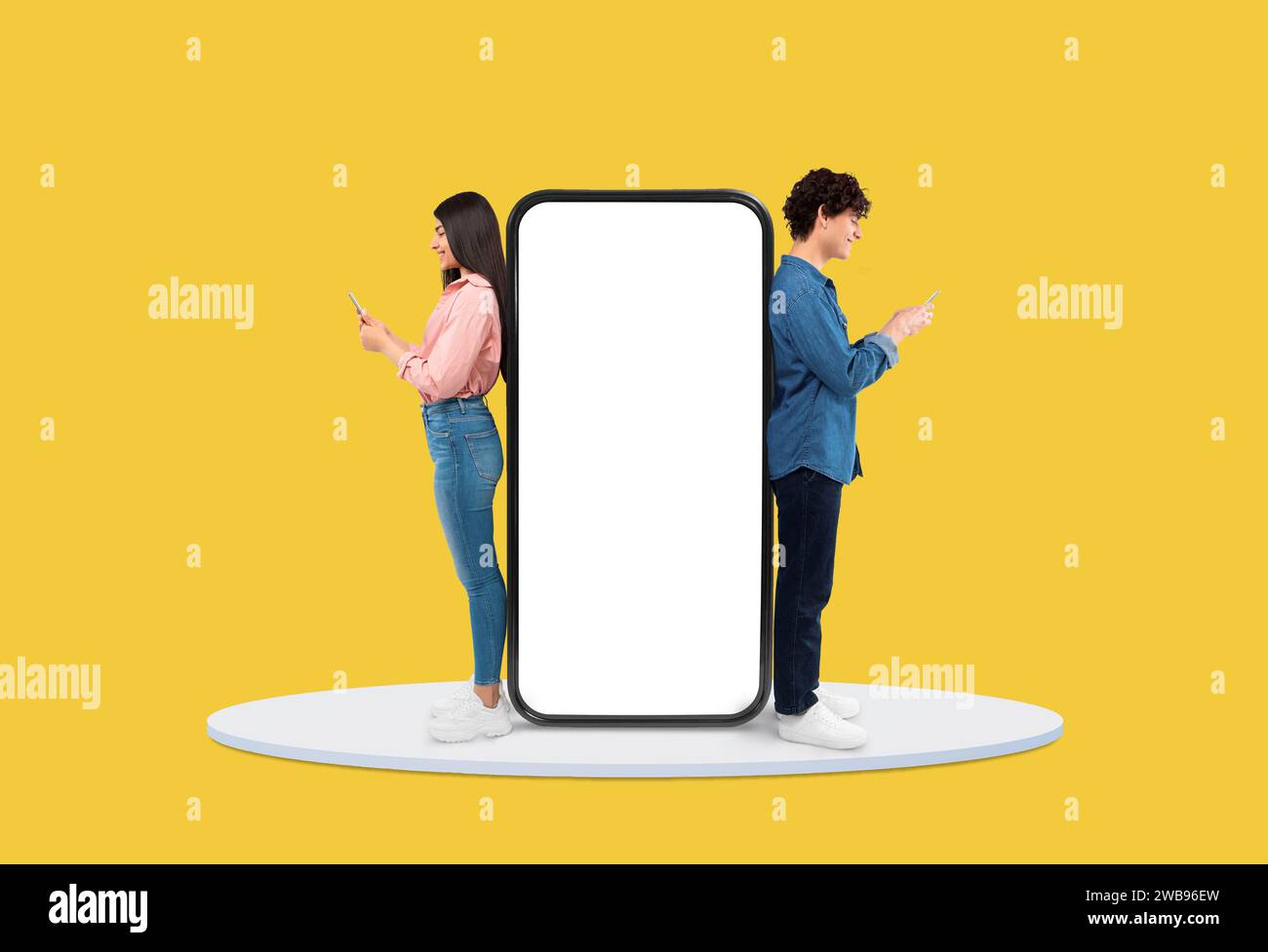 Teens with smartphones beside giant blank screen Stock Photo - Alamy