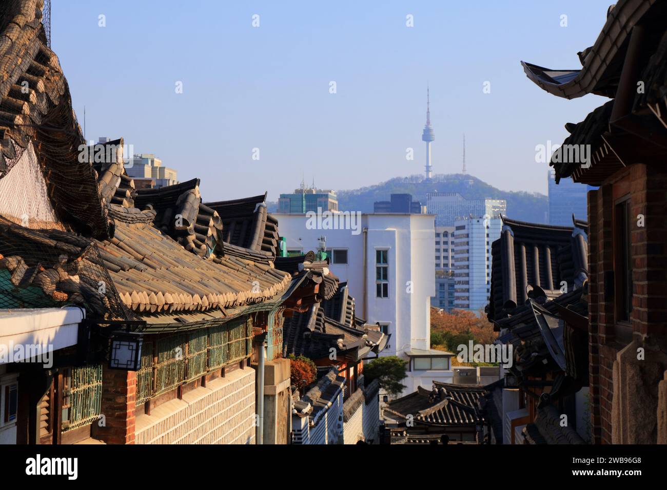 Bukchon Hanok Village in Seoul, South Korea. Seoul skyline seen from ...