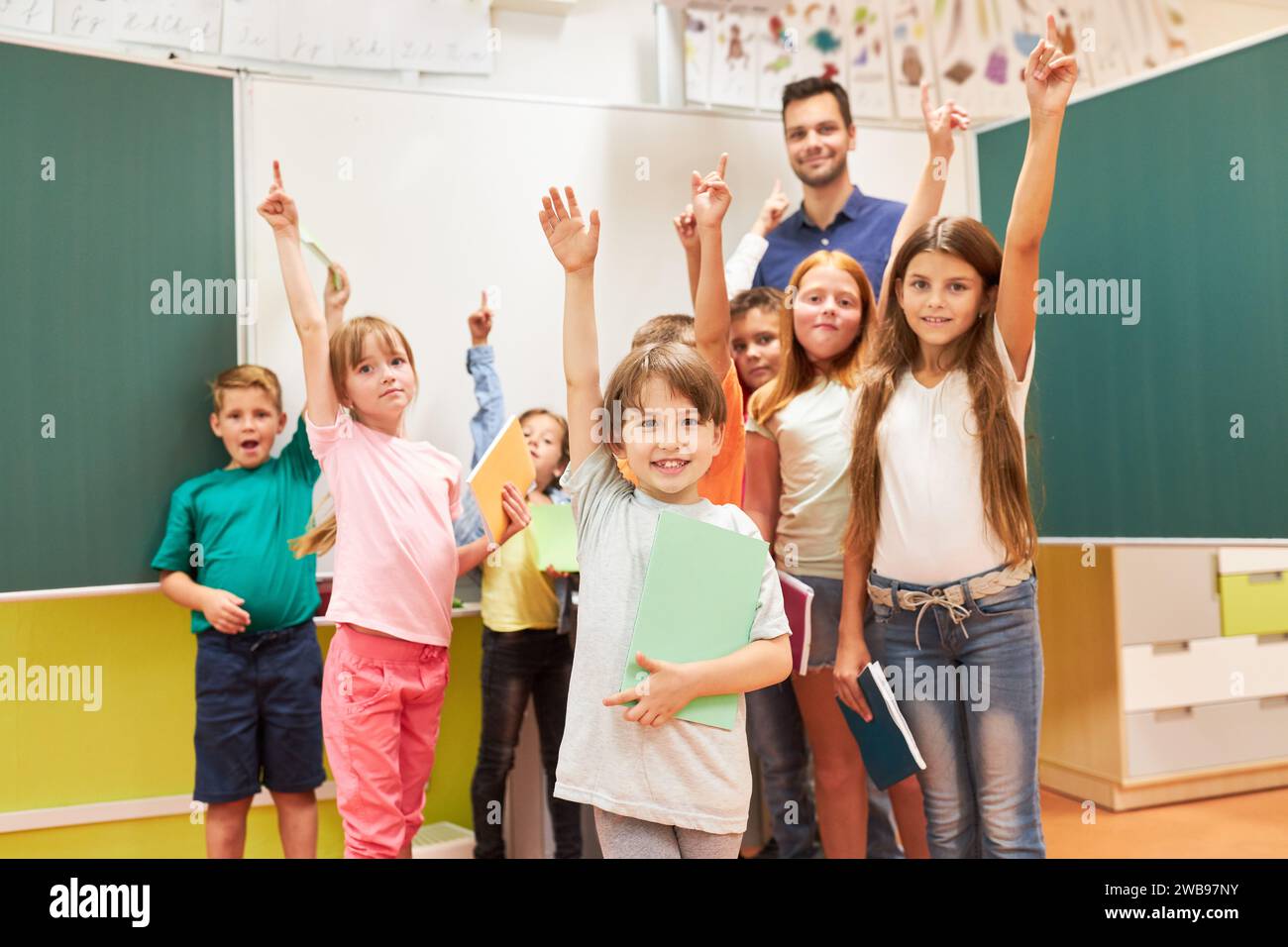 Classroom hands raised teacher hi-res stock photography and images - Alamy