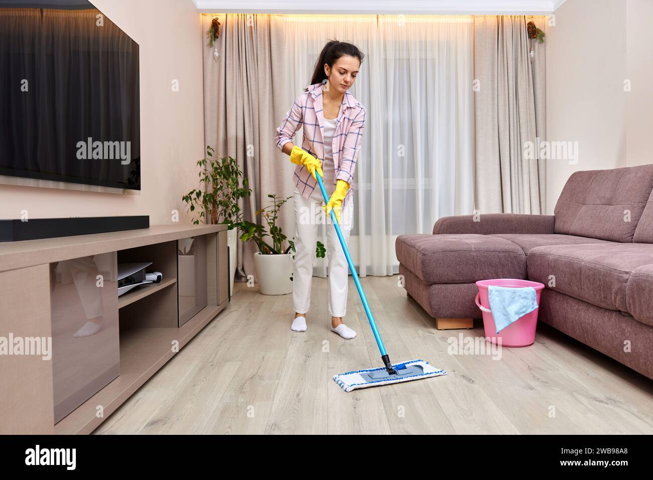 Mop flooring woman cleaning hi-res stock photography and images - Alamy