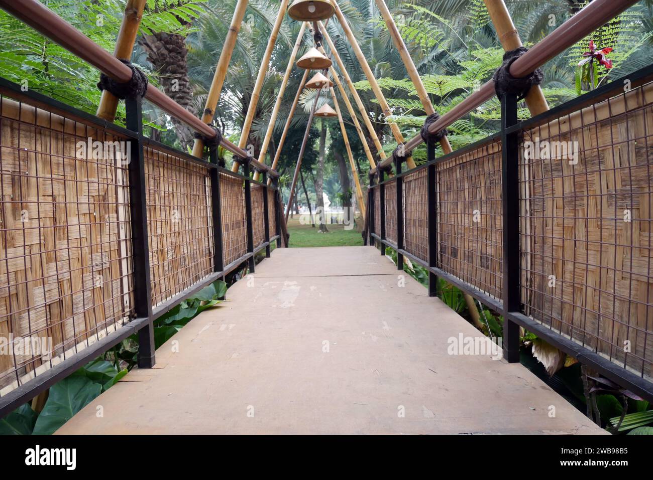 Bamboo bridge with unique traditional lights and woven bamboo as ...