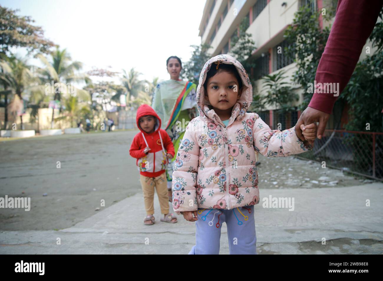 Voters along their children come at the Donia College Polling Center in ...