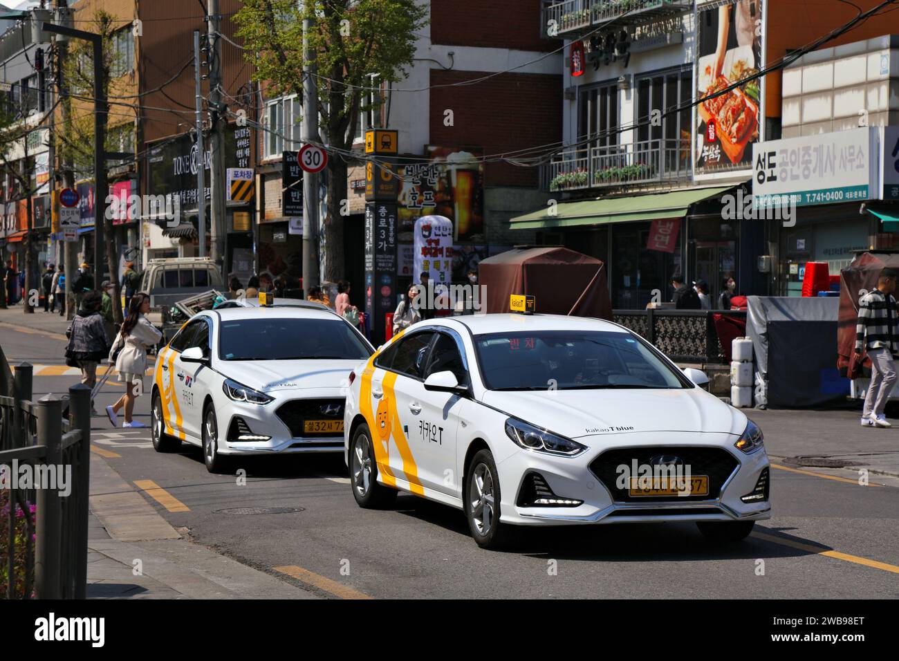 SEOUL, SOUTH KOREA - APRIL 9, 2023: Kakao T taxis drive in Seoul. Kakao ...