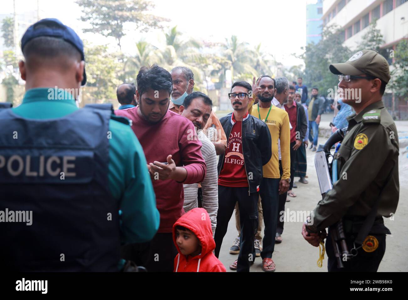 Voters queue in front of a polling center at Donia College Polling ...