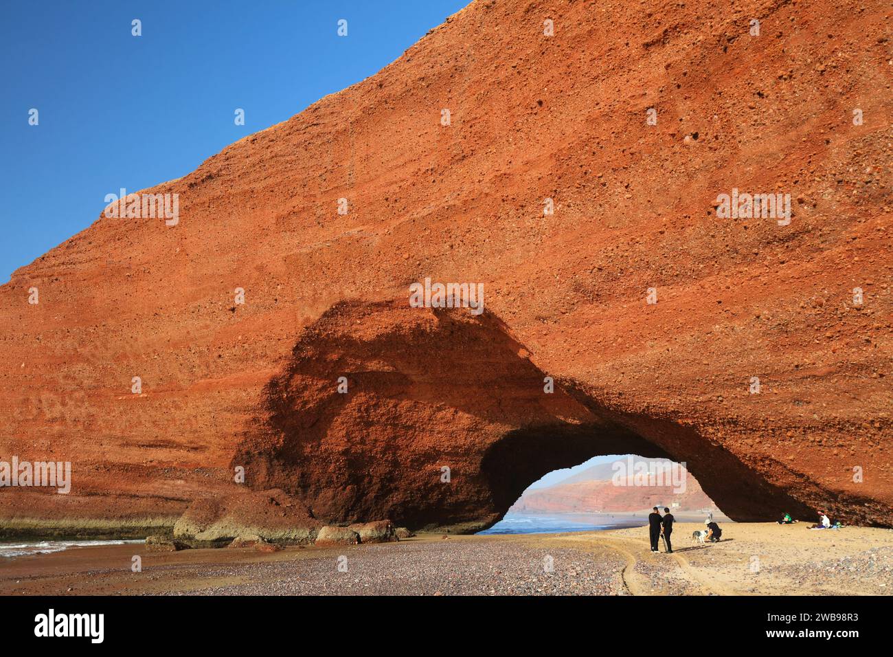 Morocco nature. Natural sedimentary rock arch and sandy beach in ...