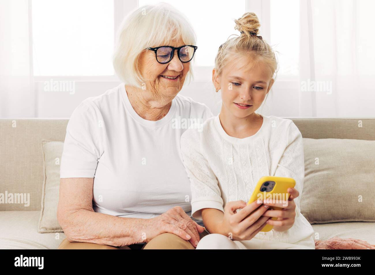 Family grandmother child selfie bonding hugging phone Stock Photo - Alamy