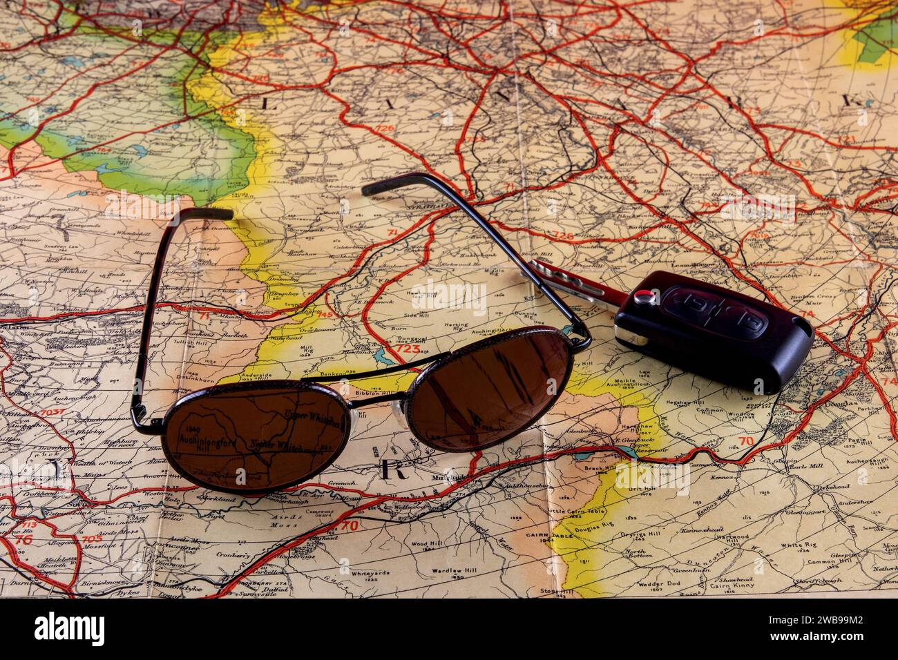 Car key and sunglasses on an old motoring route map Stock Photo - Alamy