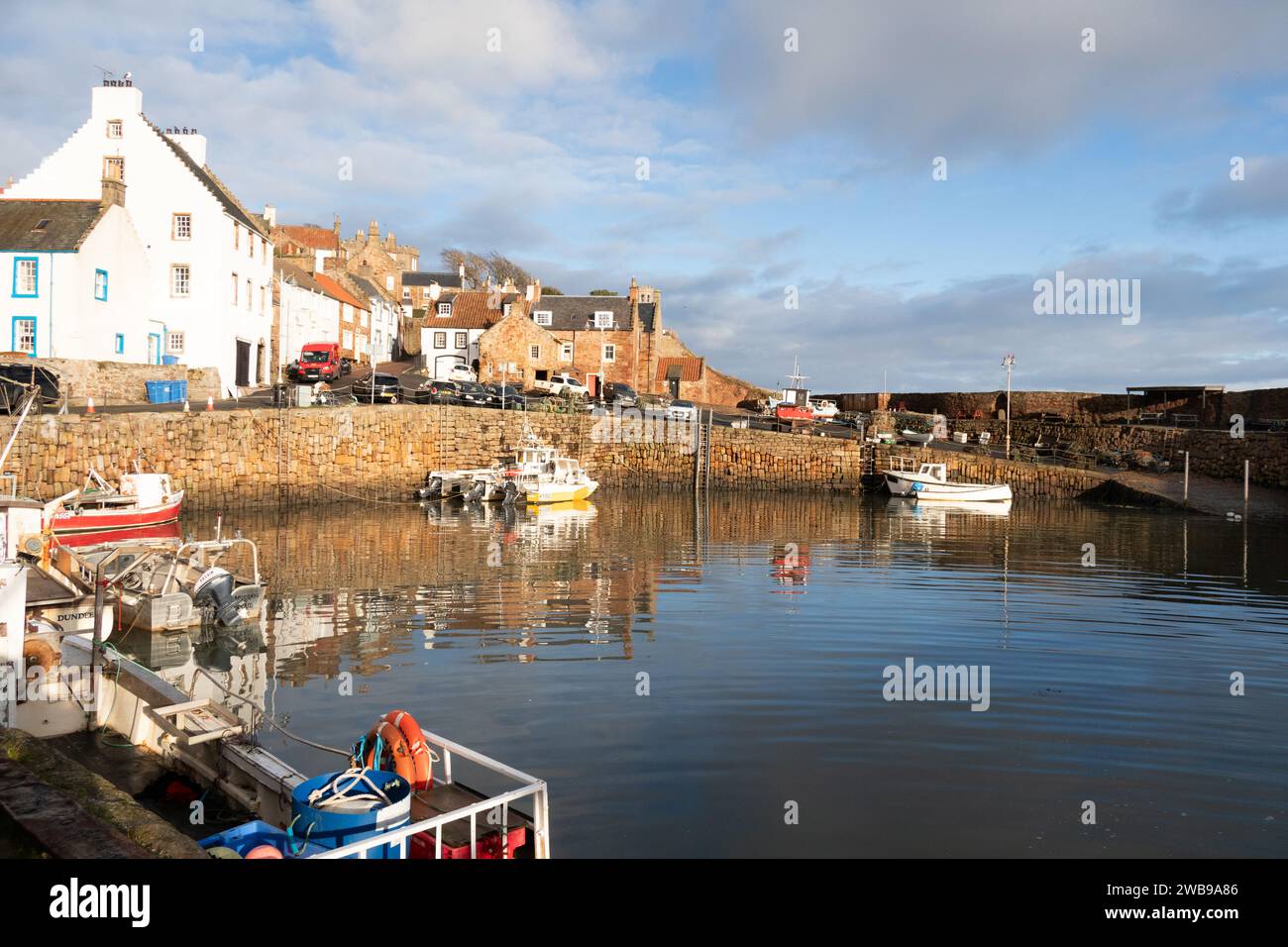Small sheltered harbour in the Scottish fishing village of Crail East ...