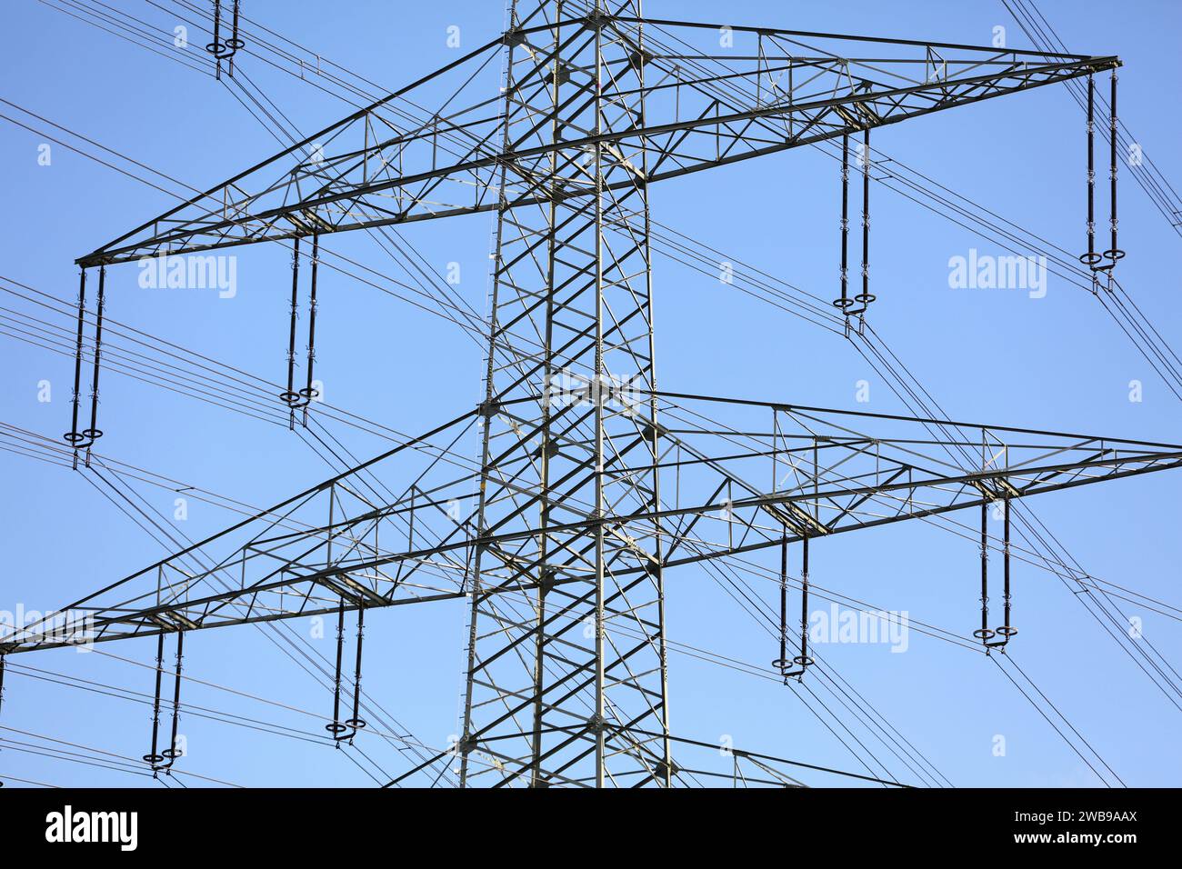 High tension power lines. Electric grid pylon in Gelsenkirchen, Germany ...