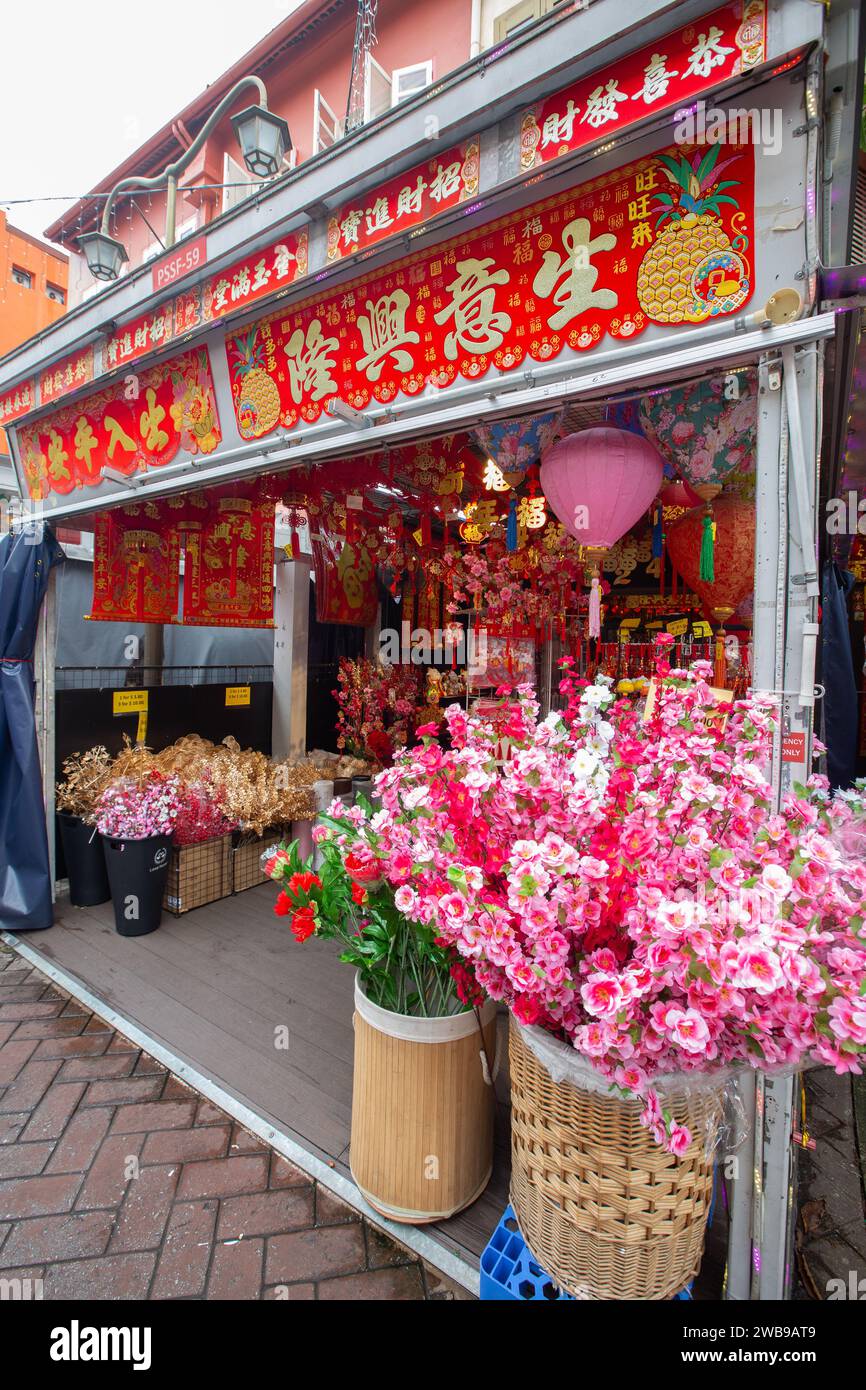 A bright red shop along the street that sells Chinese New Year theme ...