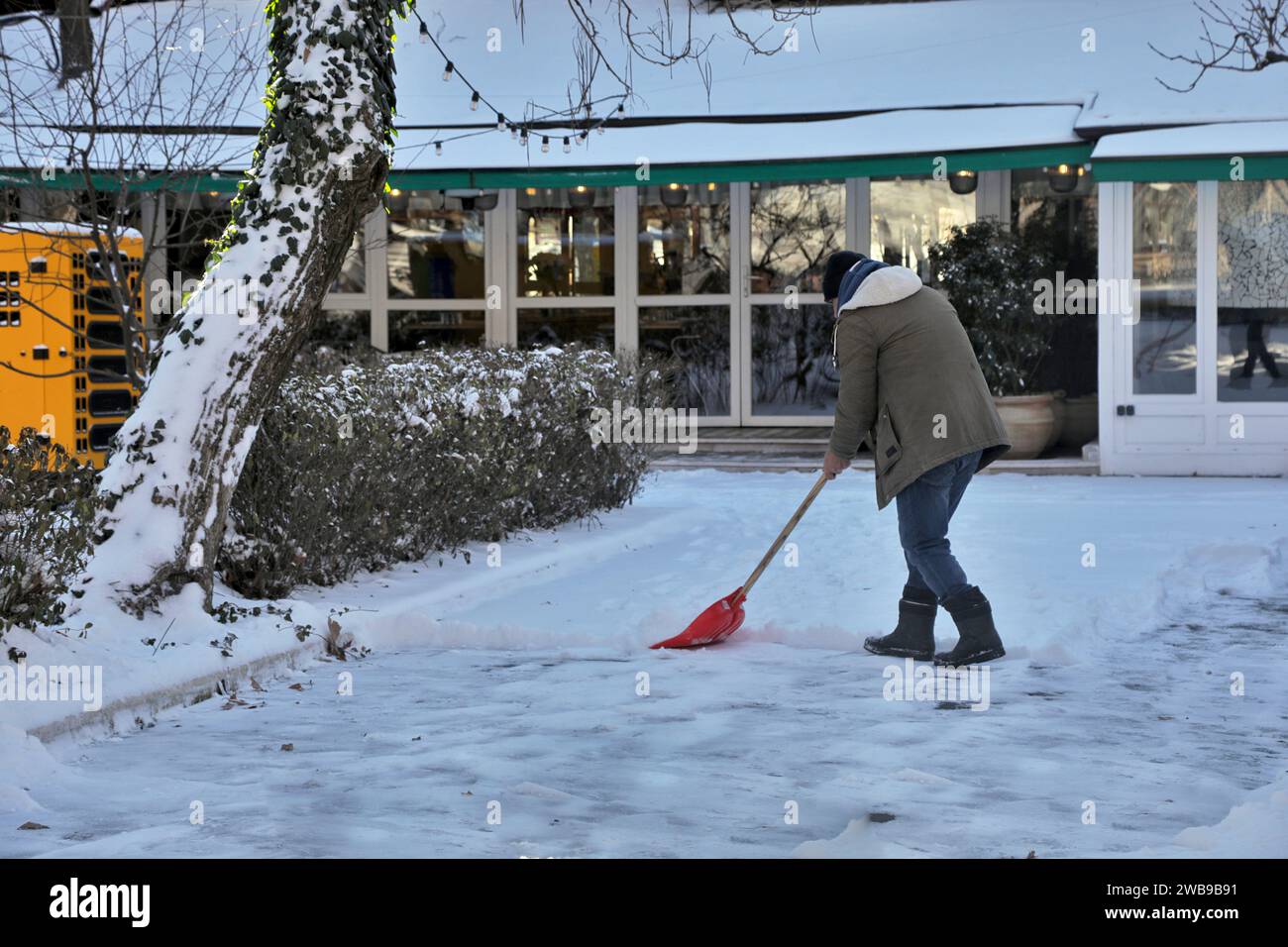 Non Exclusive: ODESA, UKRAINE - JANUARY 09, 2024 - A man clears snow on ...