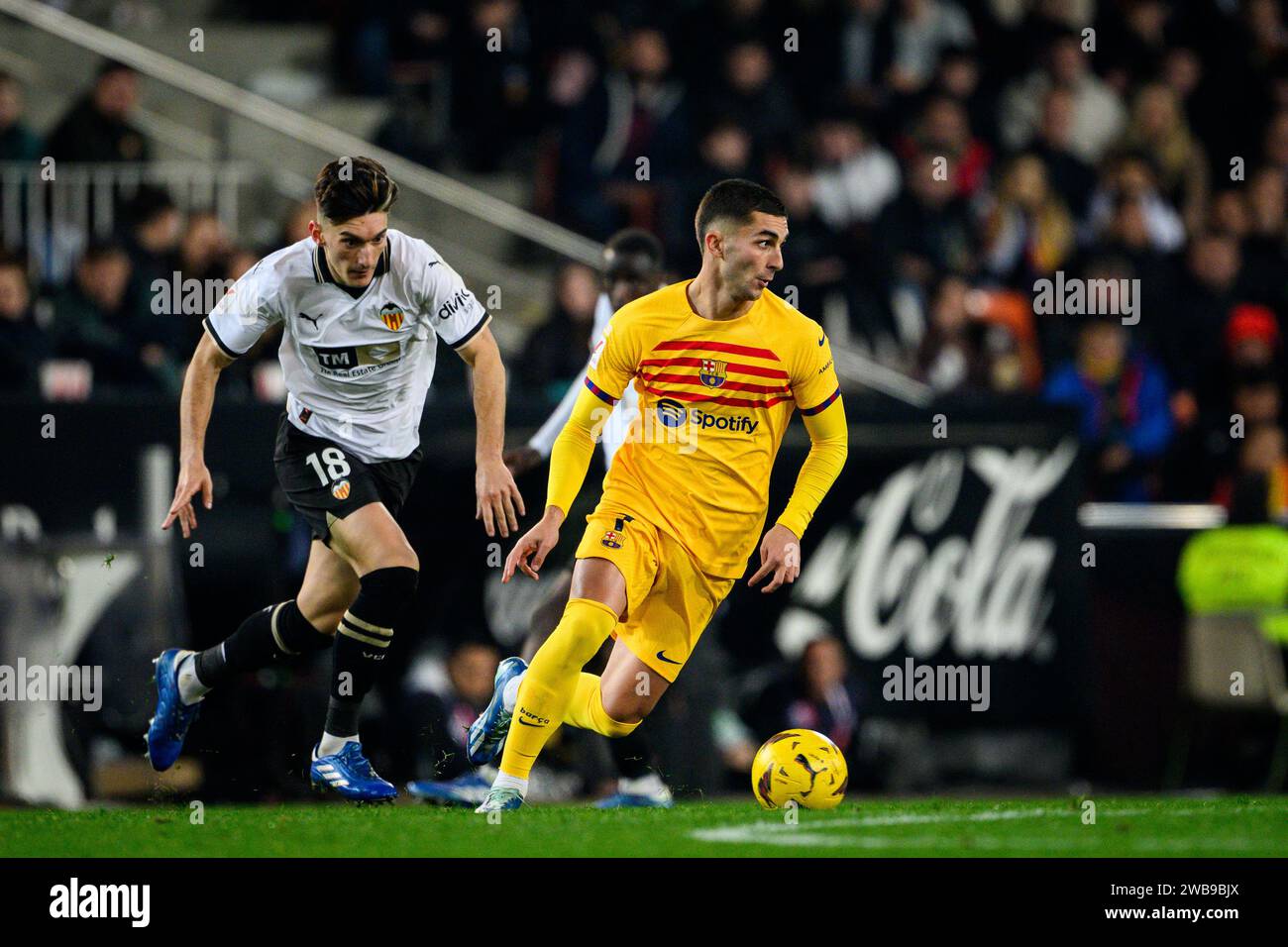 Ferran Torres, Spanish player of FC Barcelona disputing a ball with ...