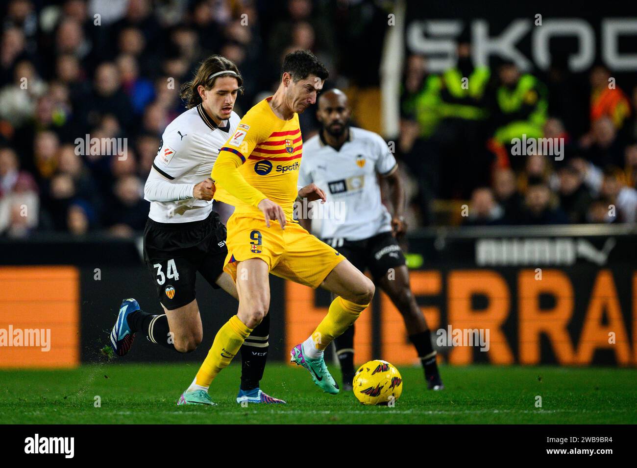 Robert Lewandowski, FC Barcelona player disputing a ball with Yarek ...