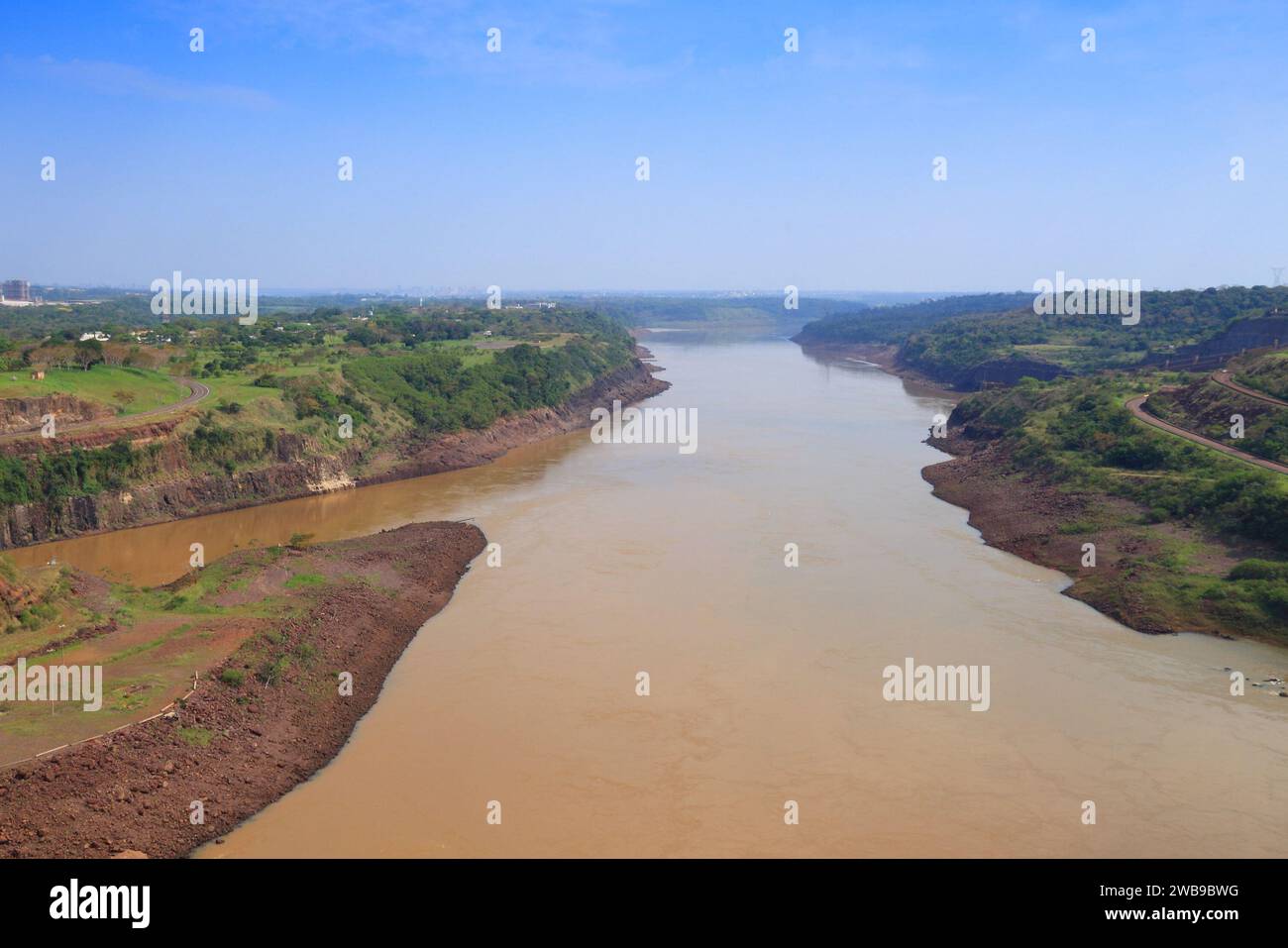 Brown water in Parana river below Itaipu Dam on the border of Paraguay ...