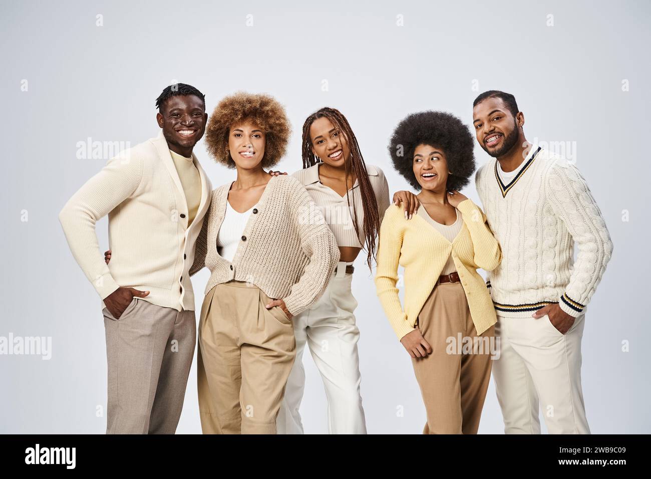 group of happy african american men and women posing with hands in ...