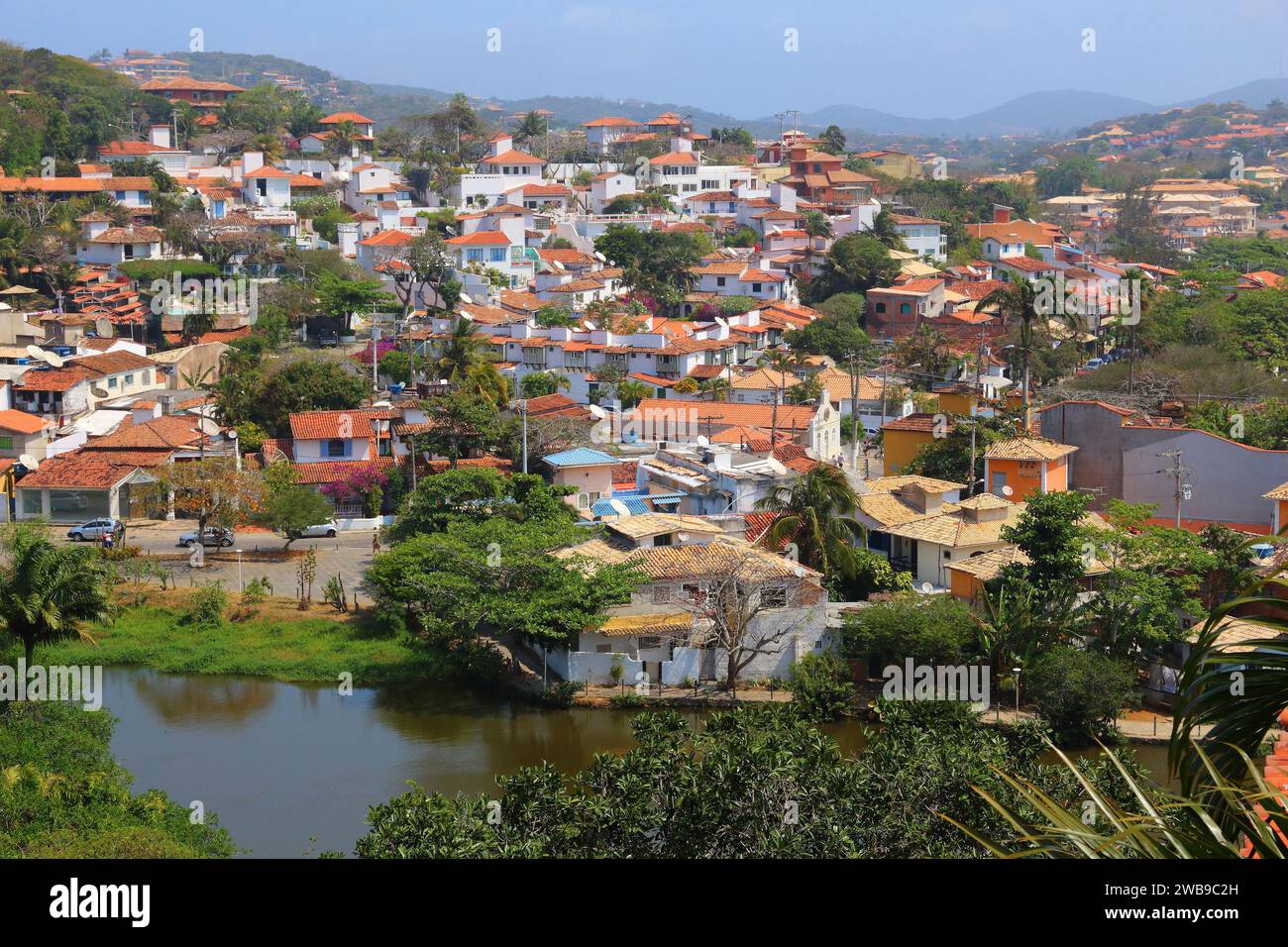 Buzios, vacation town in Brazil. Townscape with palm tree Stock Photo ...