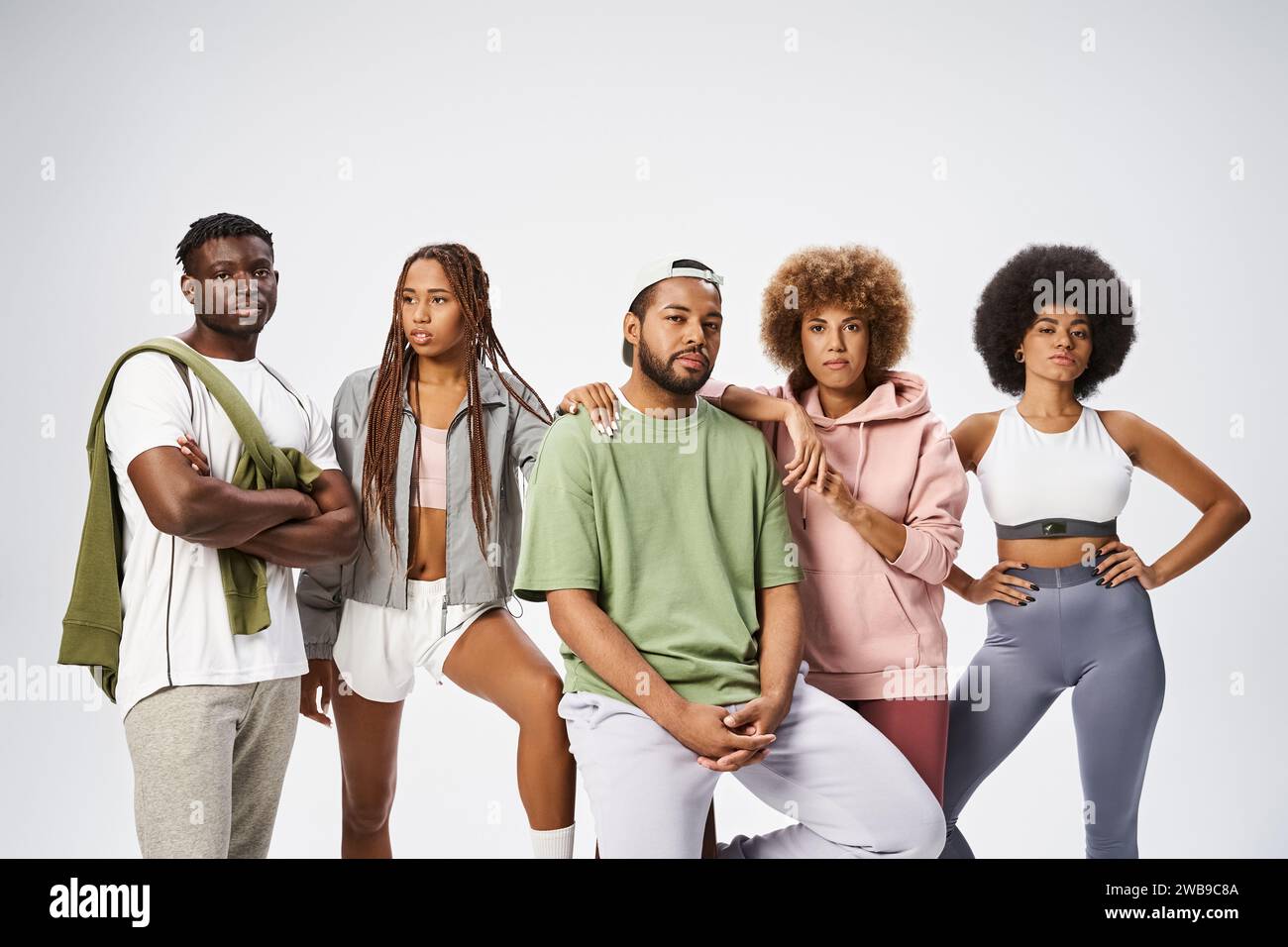 group of positive young african american friends posing together on ...