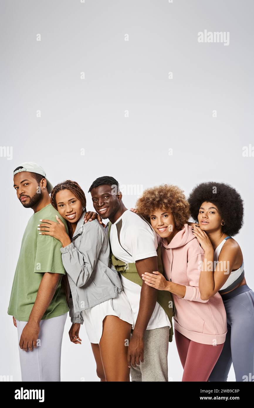 group of positive young african american friends standing together on ...