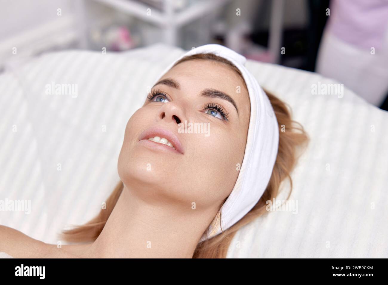 beautiful woman at spa salon. female face with healthy smooth soft skin ...