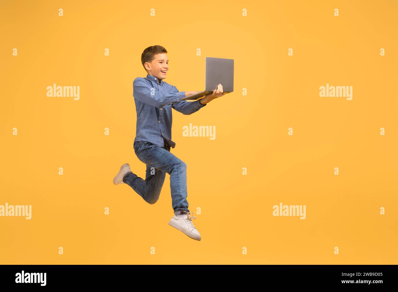 Happy jumping schoolboy on hi-res stock photography and images - Alamy