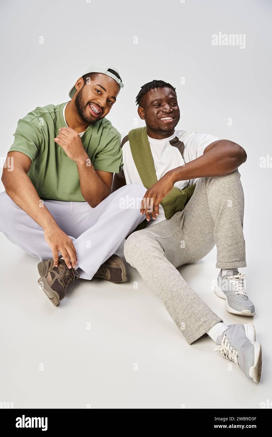 happy Juneteenth celebration, young african american man sitting with ...