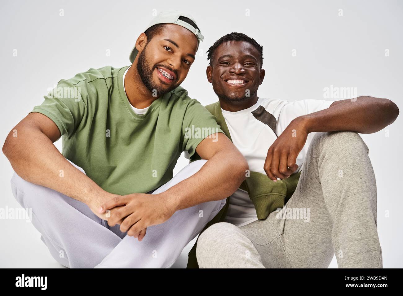 happy Juneteenth celebration, young african american man sitting with ...